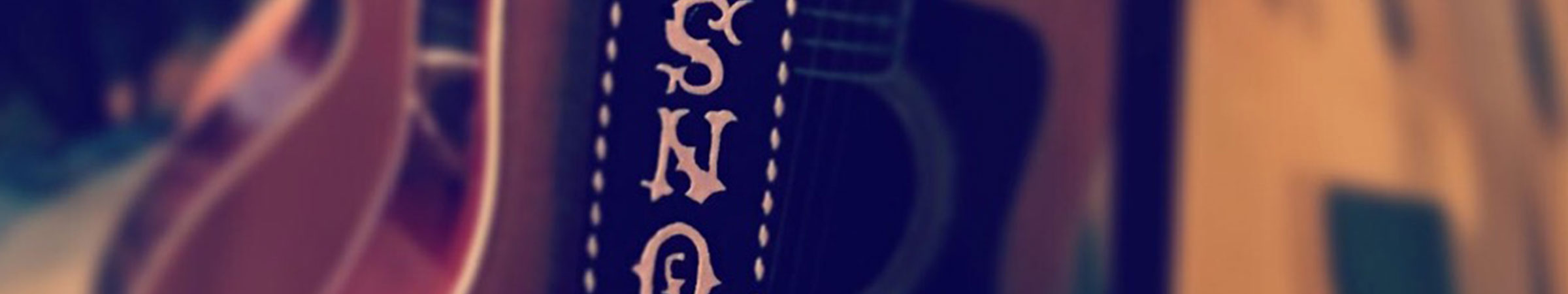 guitars-background | Tay Bronson